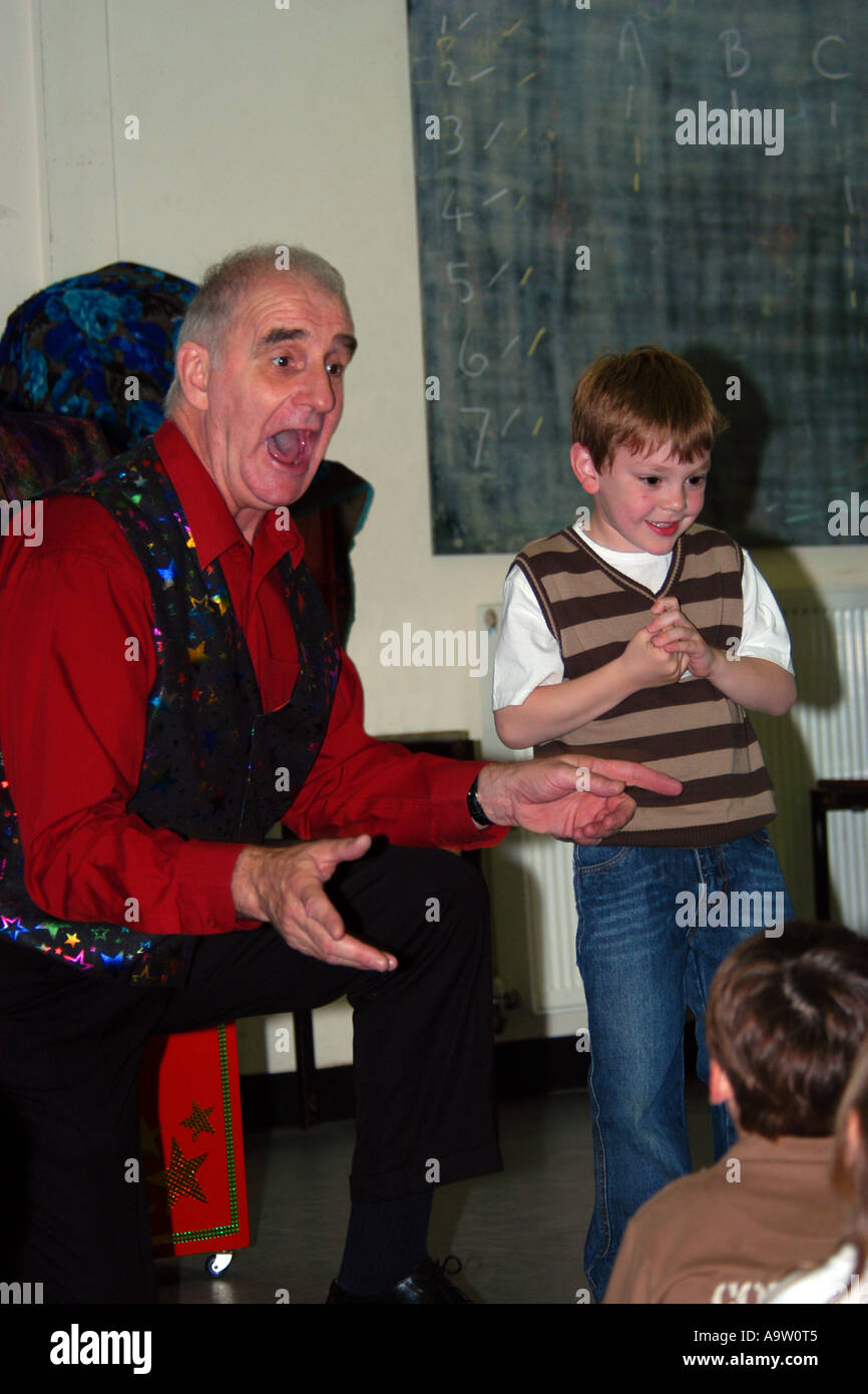 Pre-K Children having fun at a Birthday party with a magician ...