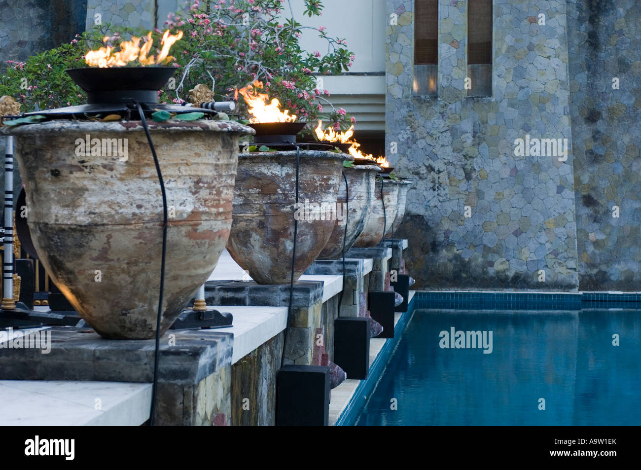 torch set by poolside at wedding Stock Photo - Alamy