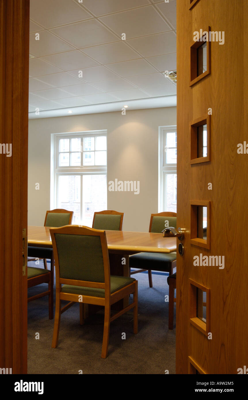 Looking through office door into meeting room Stock Photo - Alamy