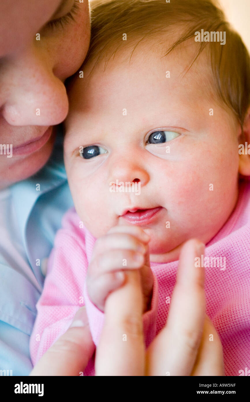 Baby Holding Mother's Finger Stock Photo - Alamy