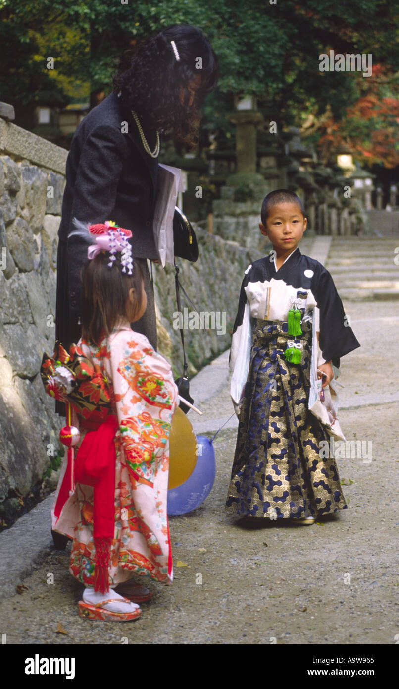 Children in Japanese traditional dress visiting shrines at Nara Japan ...