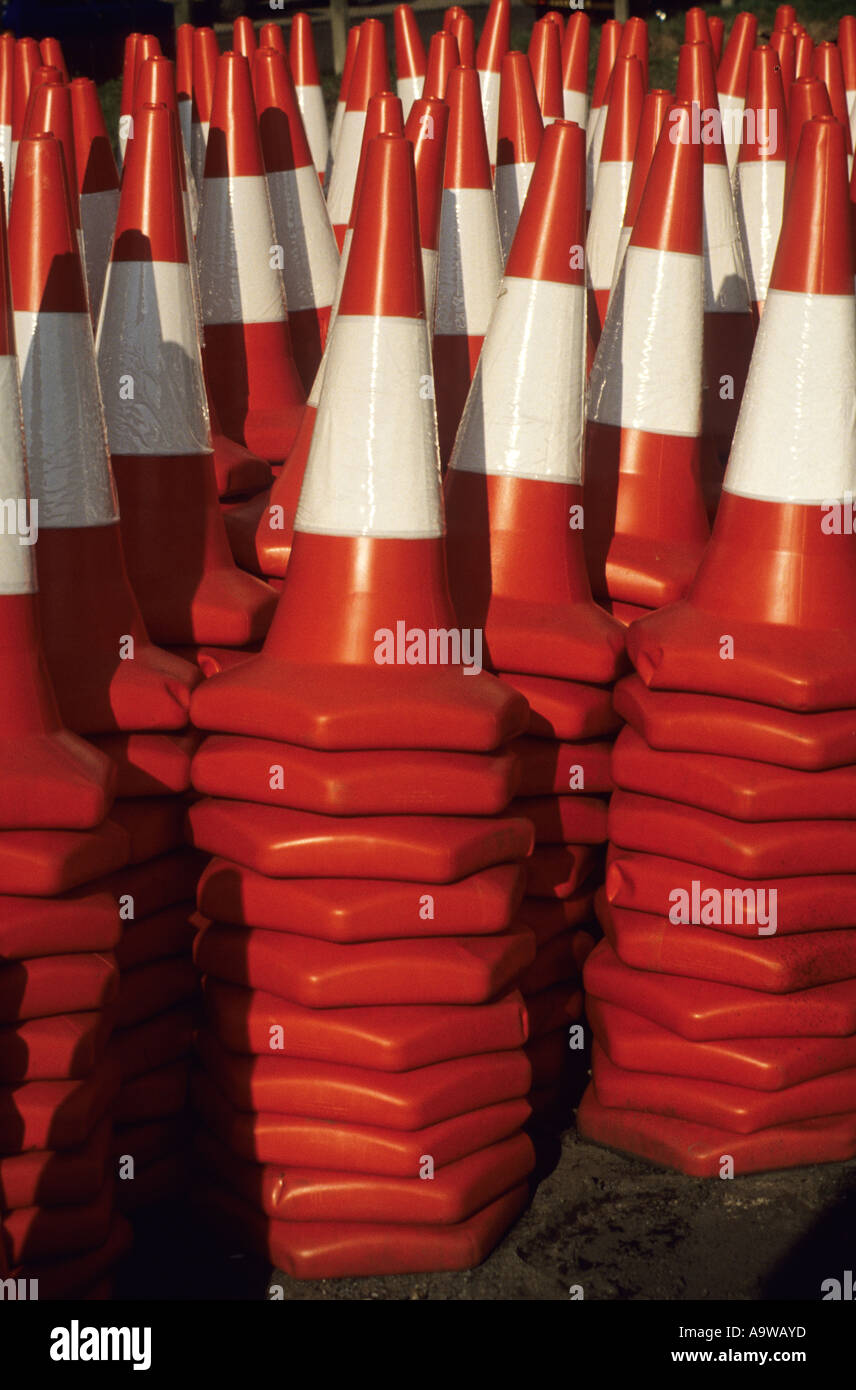 Stacks of new orange plastic road cones Stock Photo - Alamy