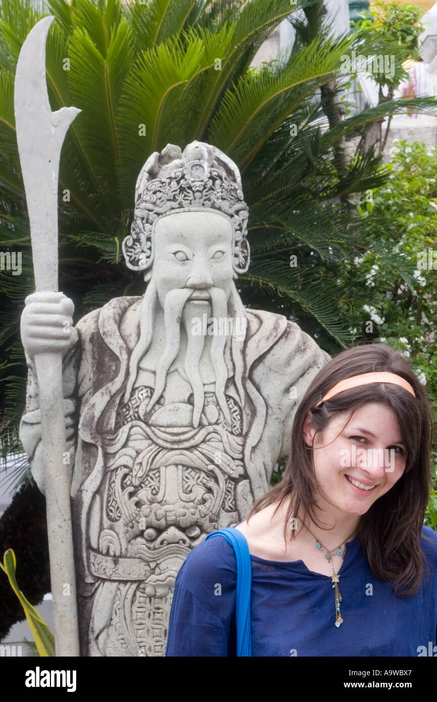 Western tourist posing in front of a statue in The Grand Palace Stock ...