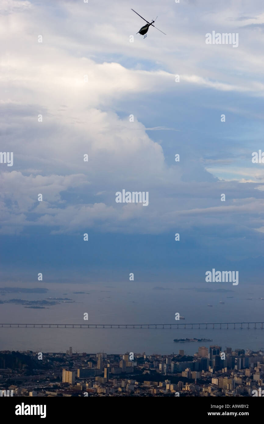 Helicopter flying above Rio at dusk Stock Photo - Alamy