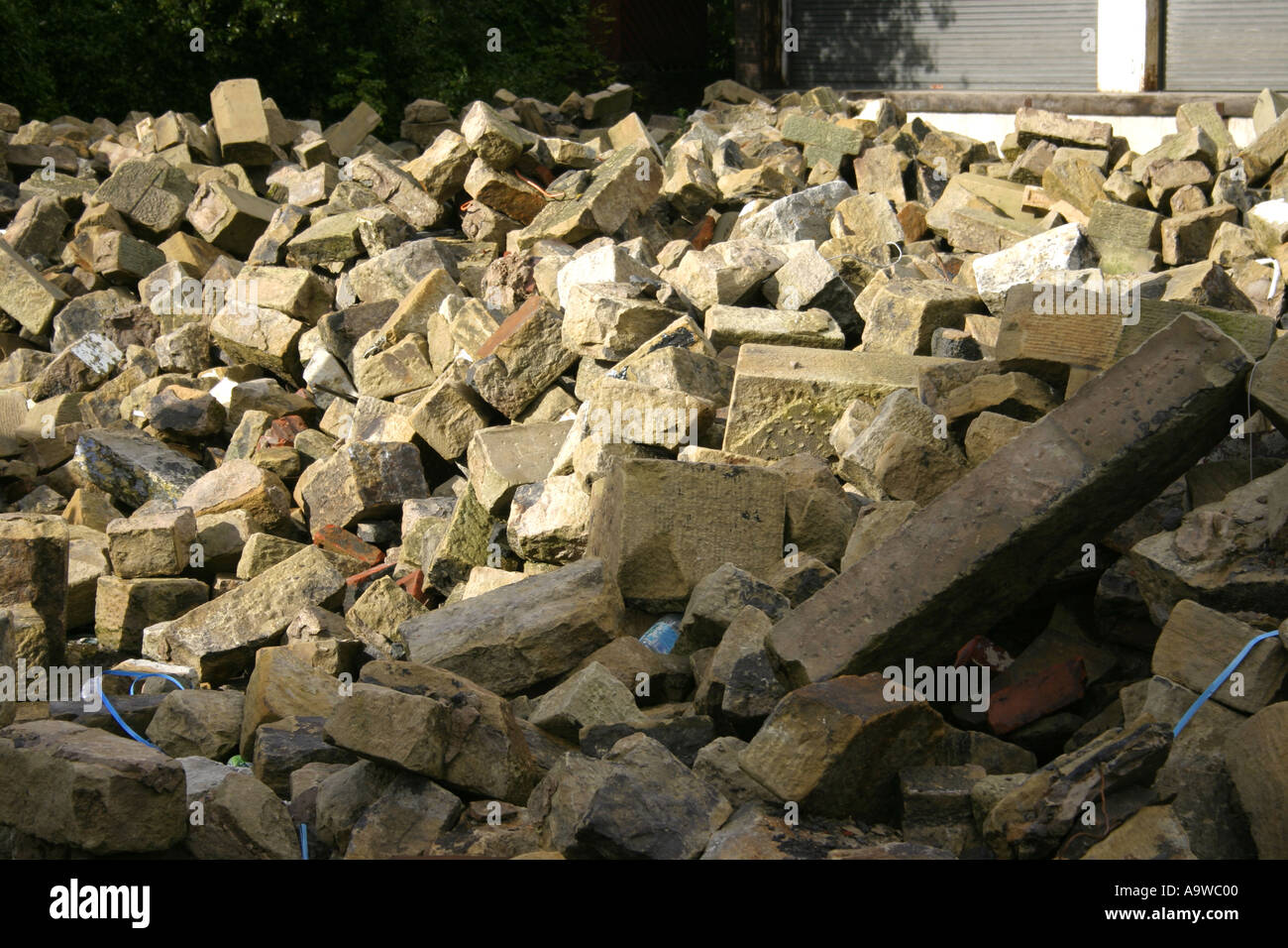 Stone rubble to be re used on a new building Stock Photo - Alamy