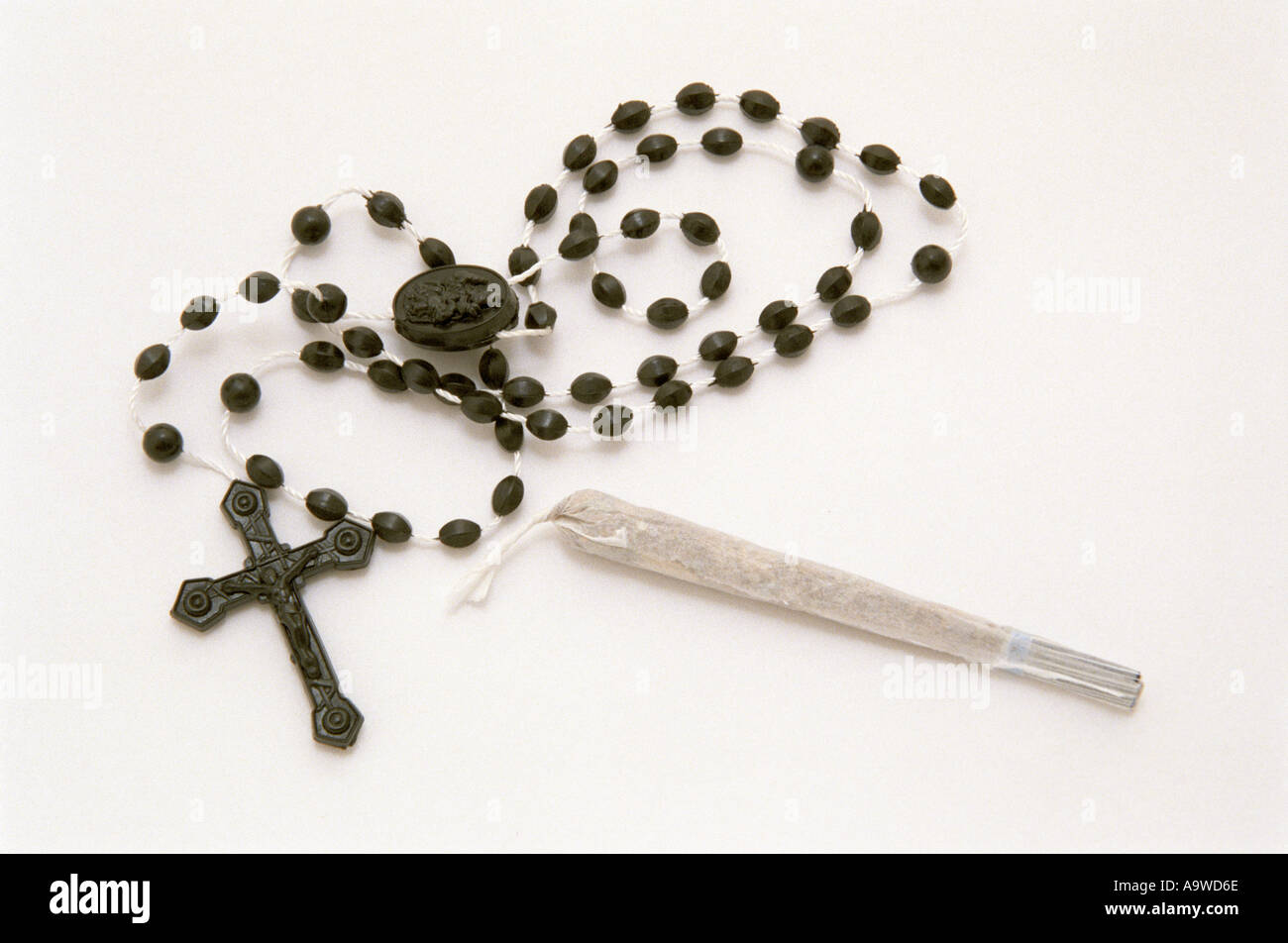 Rosary with a Spliff joint of Marijuana cannibis Stock Photo - Alamy
