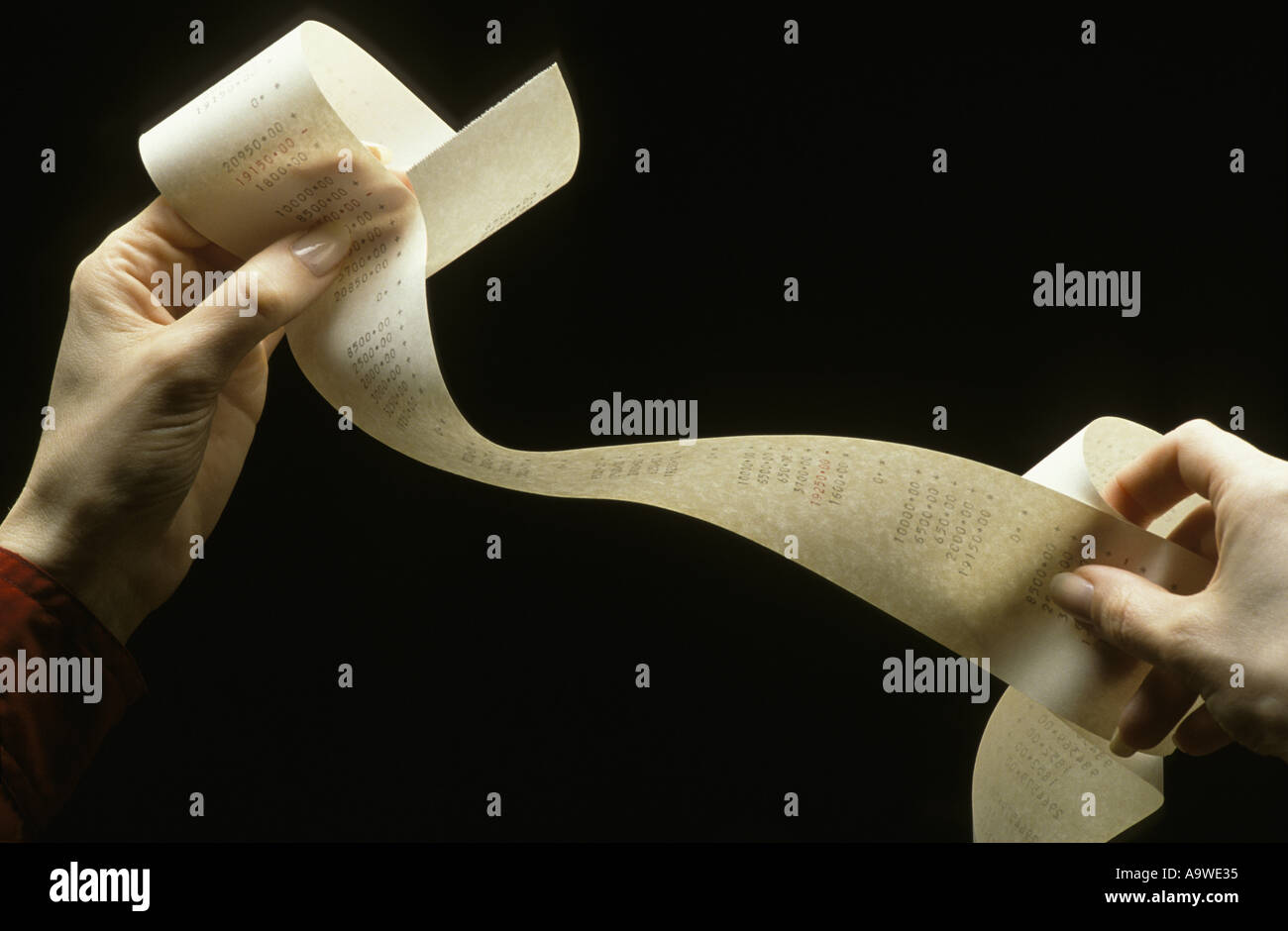 White female holding up adding machine tape Stock Photo - Alamy