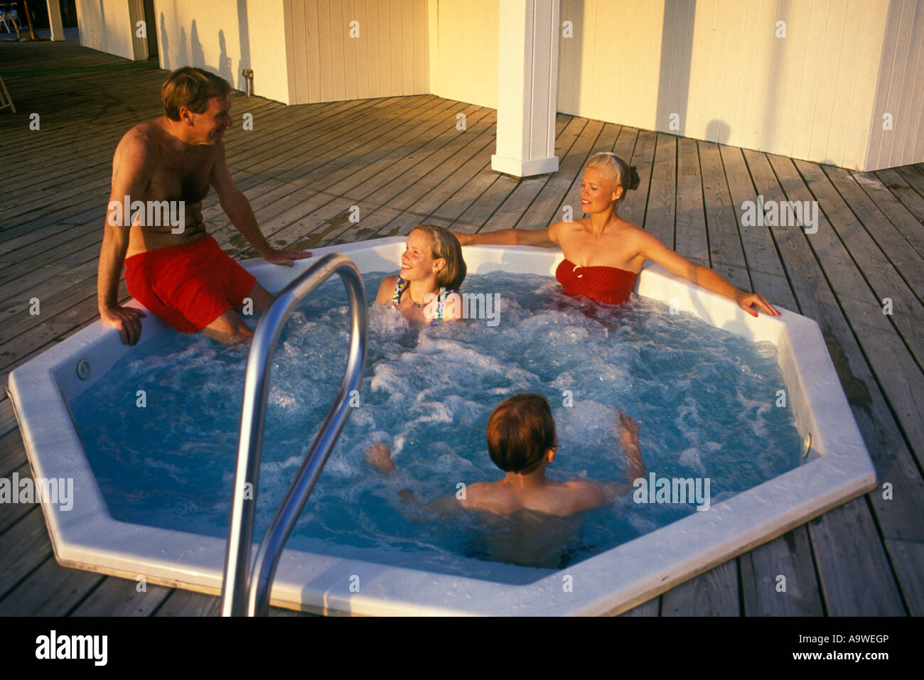 FAMILY RELAXING IN WHIRLPOOL Stock Photo - Alamy