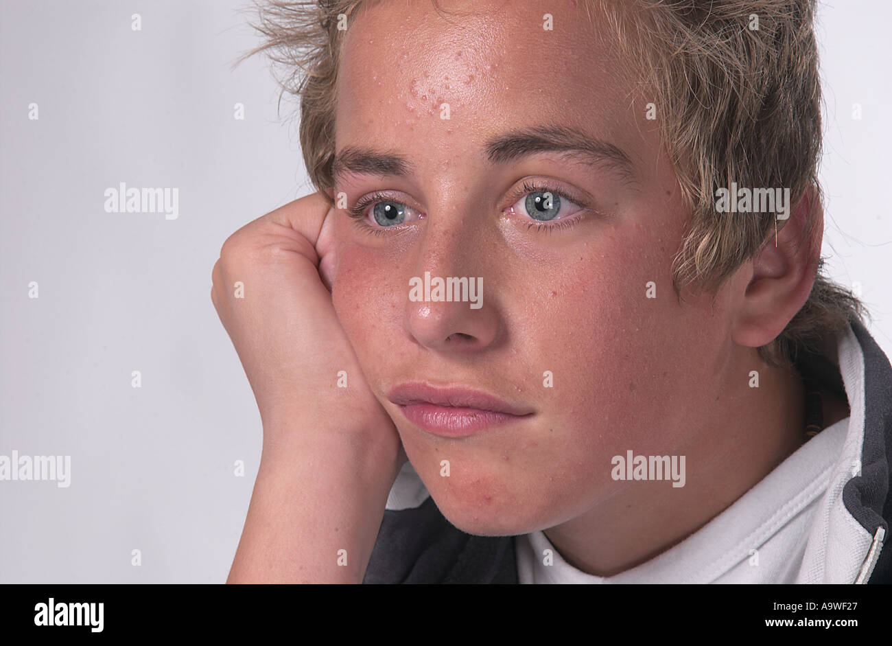 teenage boy looking bored Stock Photo - Alamy