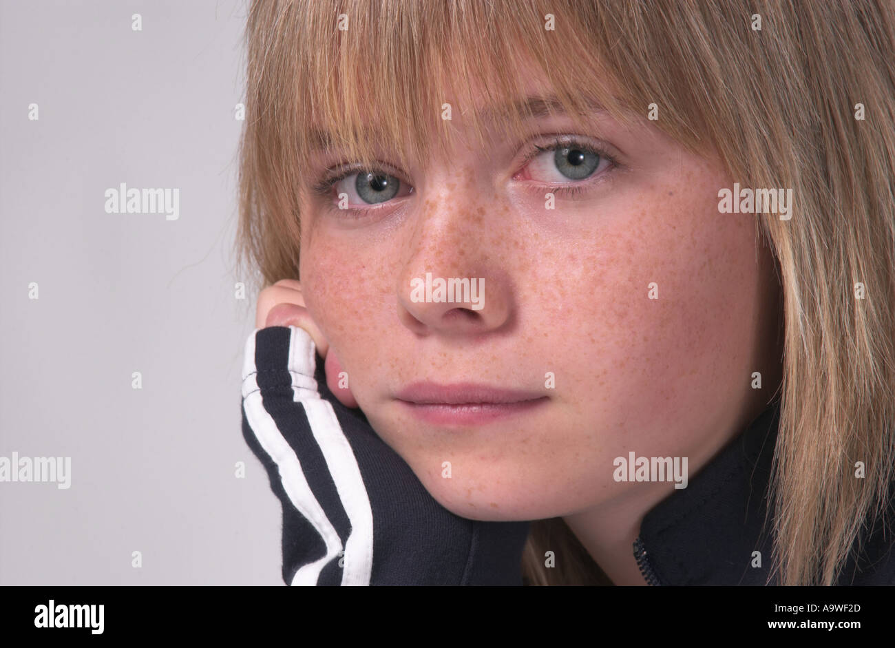 young girl looking into camera Stock Photo - Alamy