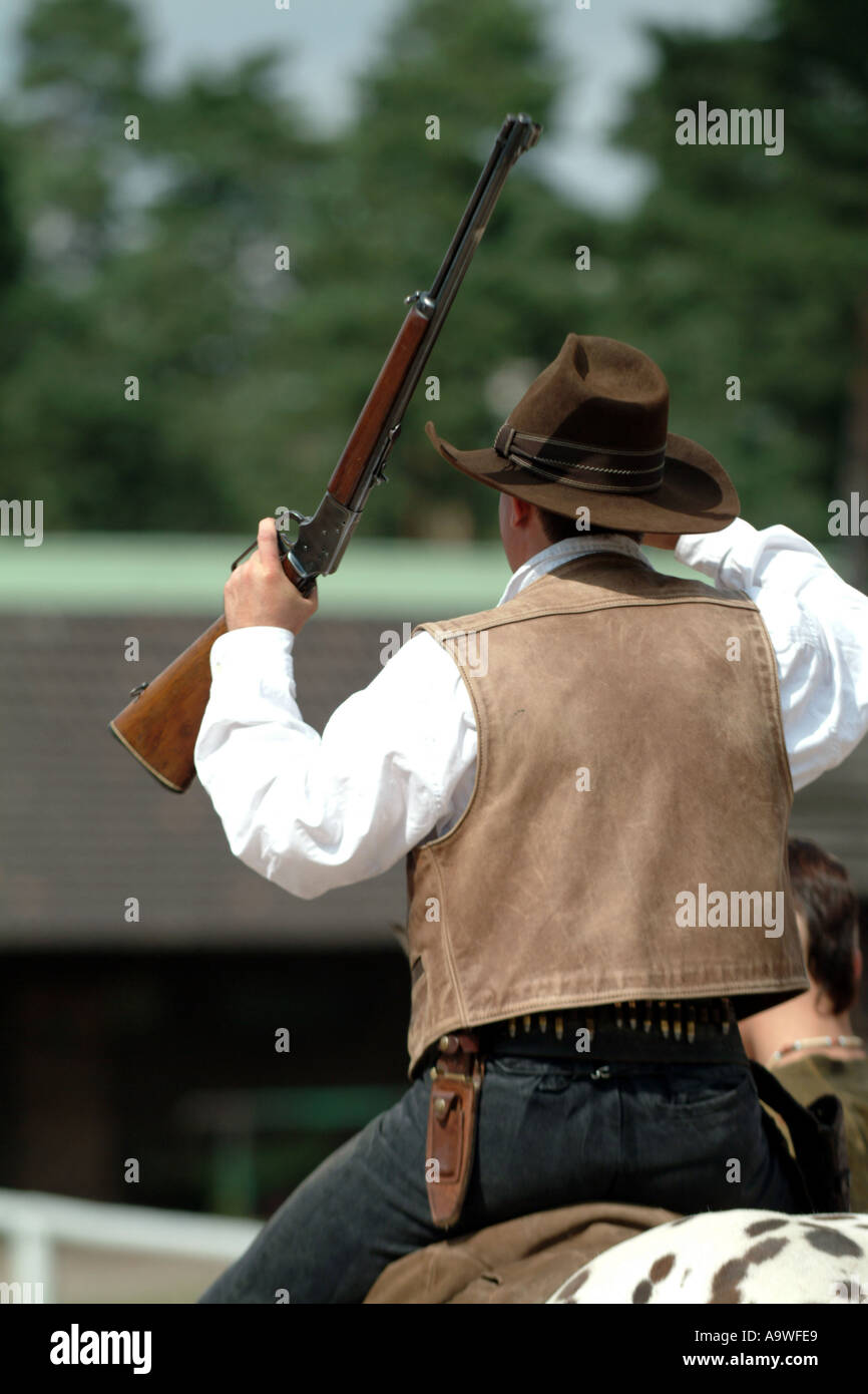Cowboy horseback with rifle hi-res stock photography and images - Alamy