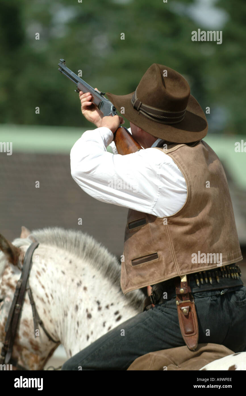 Cowboy horseback with rifle hi-res stock photography and images - Alamy