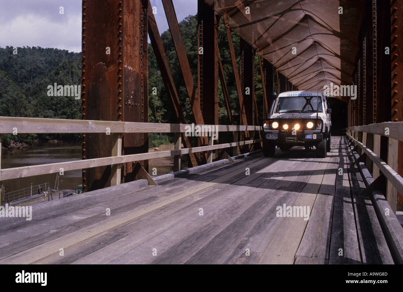 Four wheel drive vehicle crossing single track bridge in Tasmania Stock ...