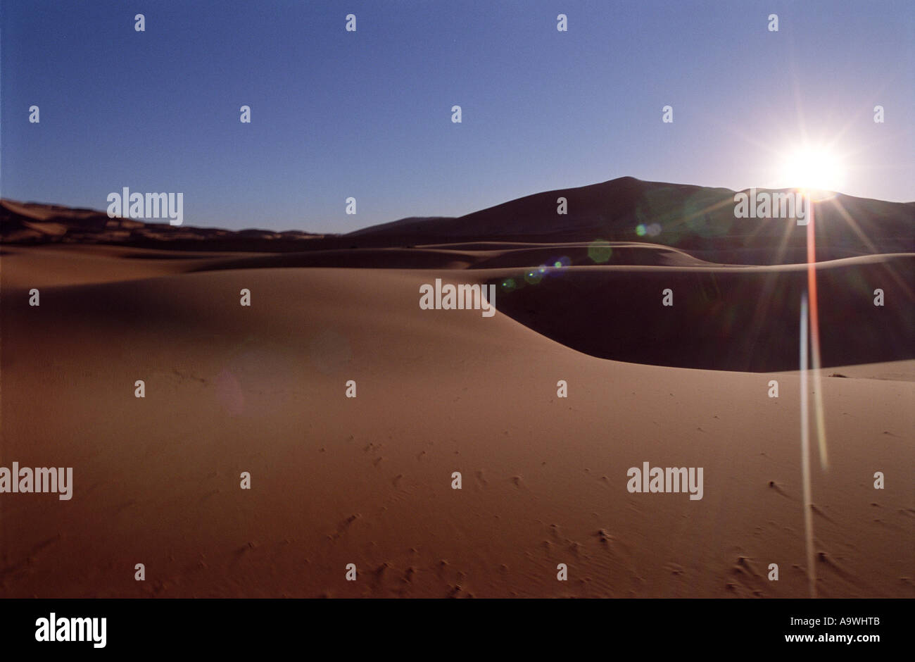 The sun setting in the Sahara dessert in Morocco Stock Photo - Alamy