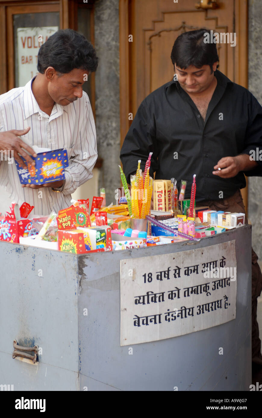 Man selling sweets in Connaught Place New Delhi India Stock Photo - Alamy