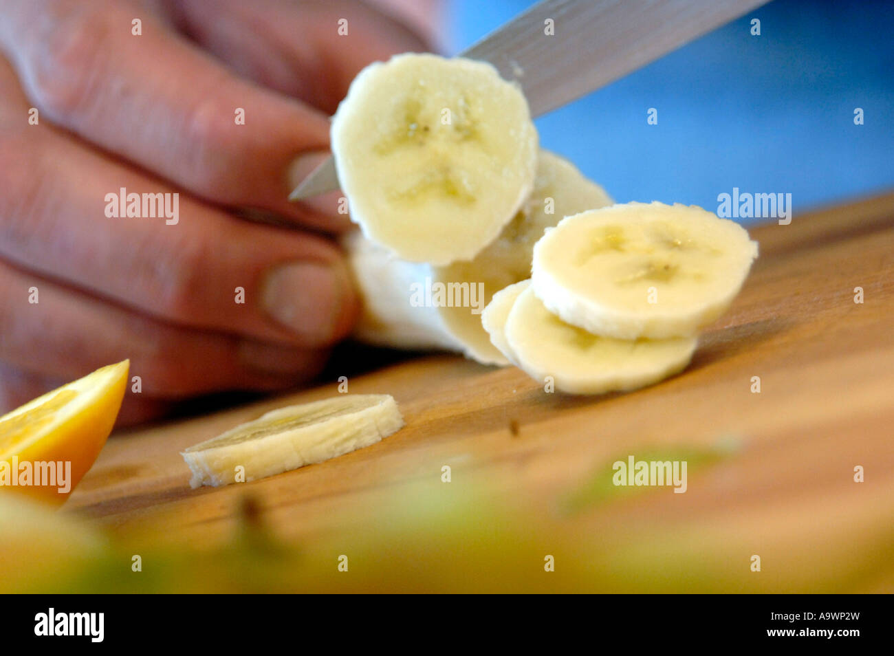 Slicing a banana Stock Photo - Alamy