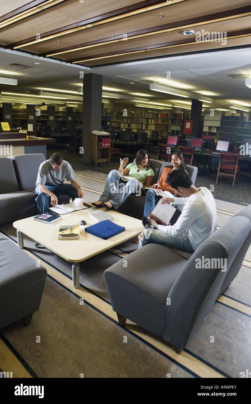 Students in library sitting on sofas studying Stock Photo - Alamy