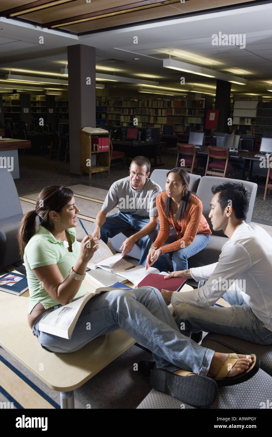 Students in library sitting on sofas studying Stock Photo - Alamy