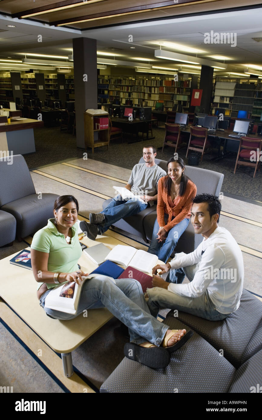 Students in library sitting on sofas studying Stock Photo - Alamy