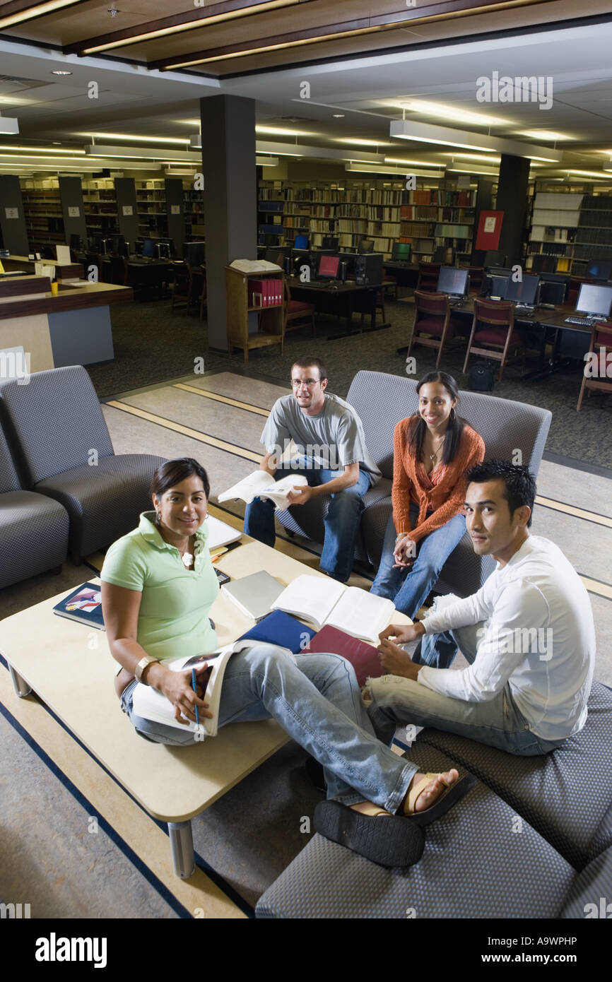 Students in library sitting on sofas studying Stock Photo - Alamy