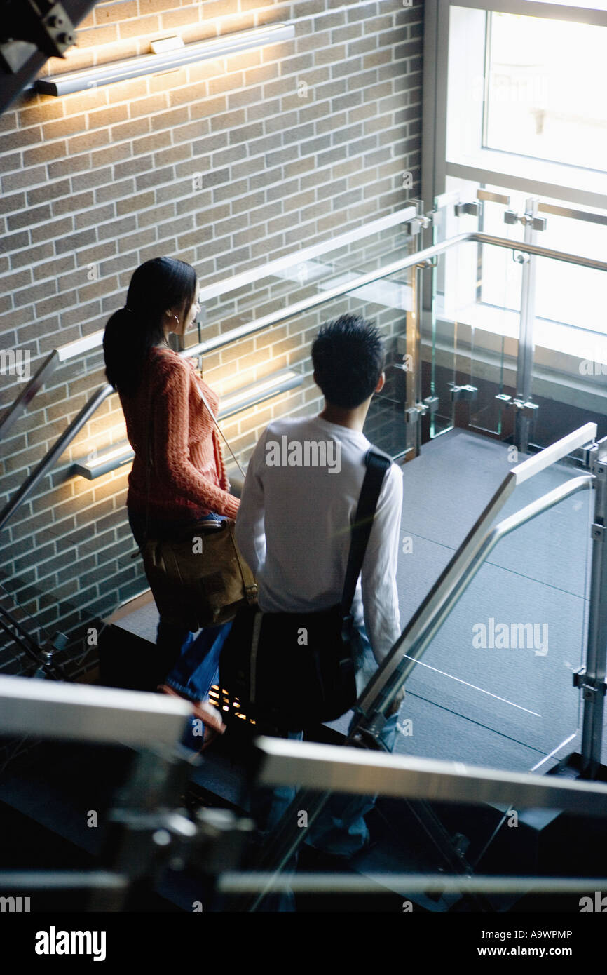 University students walking upstairs between classes Stock Photo - Alamy