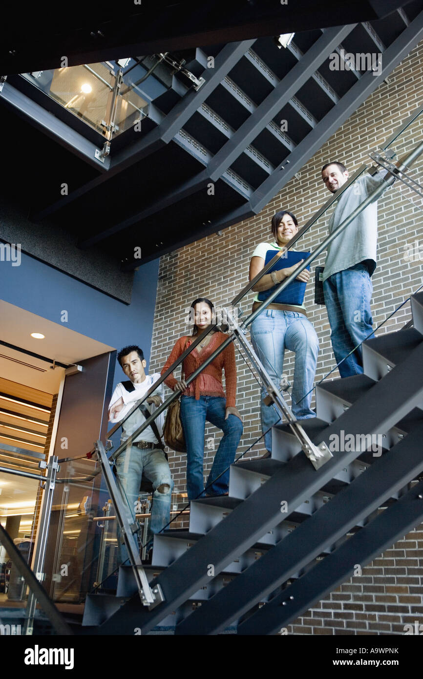 Portrait of college students standing on staircase Stock Photo - Alamy