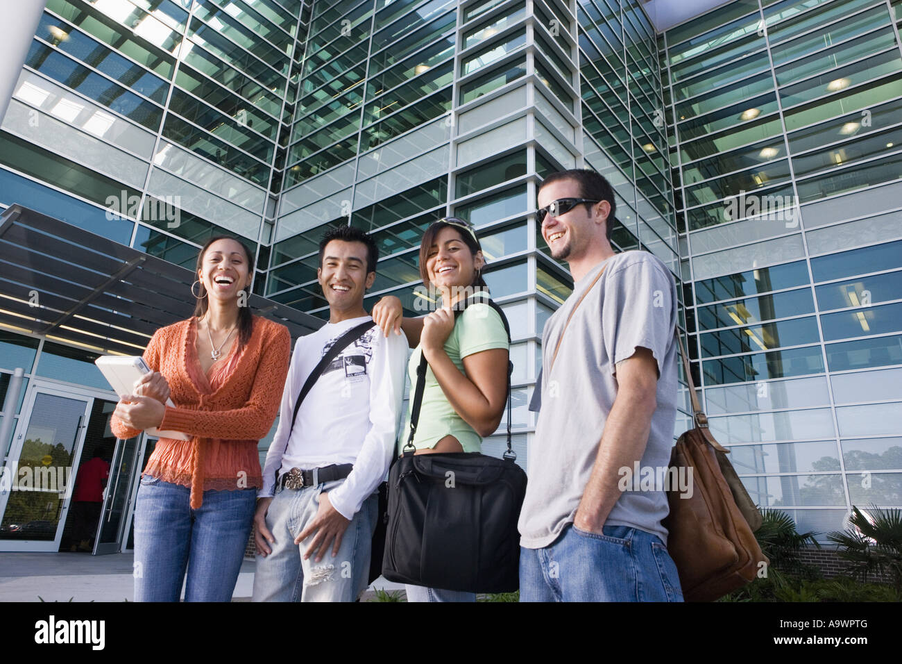 College students standing in front of a building Stock Photo - Alamy