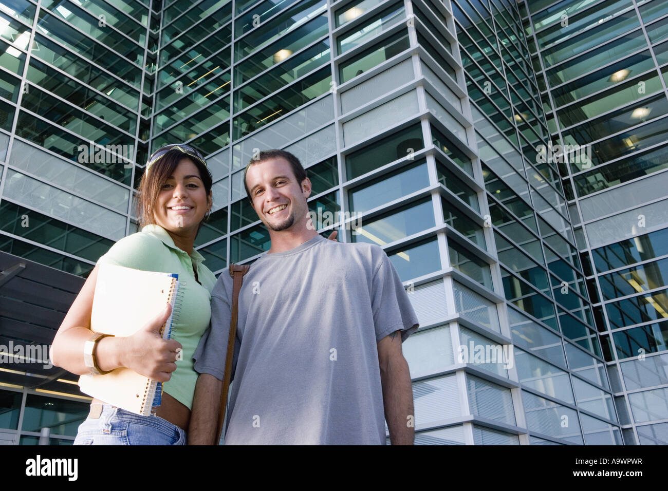 University students standing outside campus building Stock Photo - Alamy