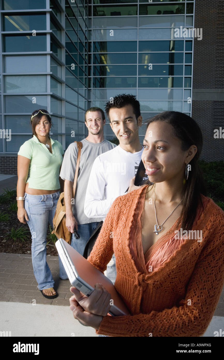 University students standing outside campus building Stock Photo - Alamy