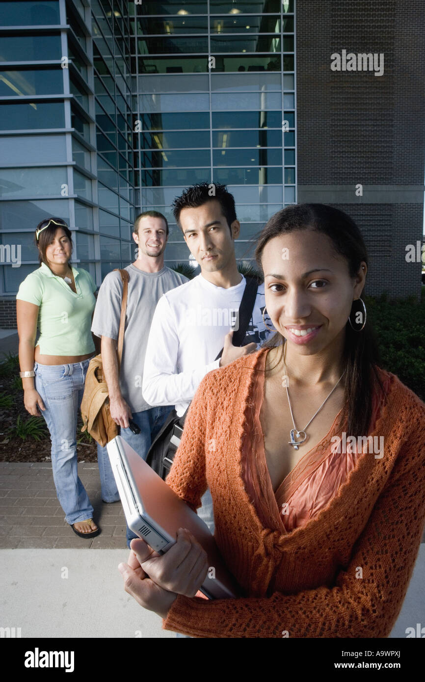 University students standing outside campus building Stock Photo - Alamy