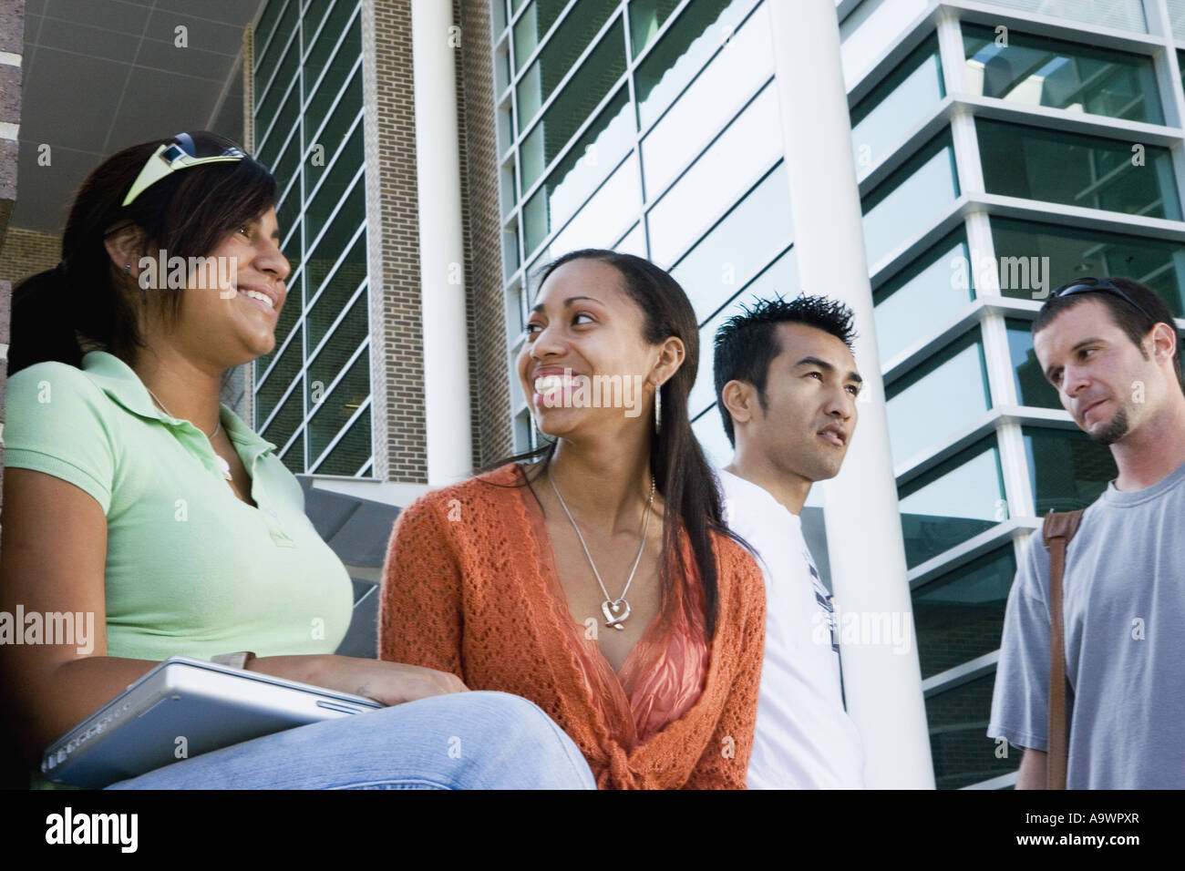 Students hanging out and socializing in front of a building Stock Photo ...