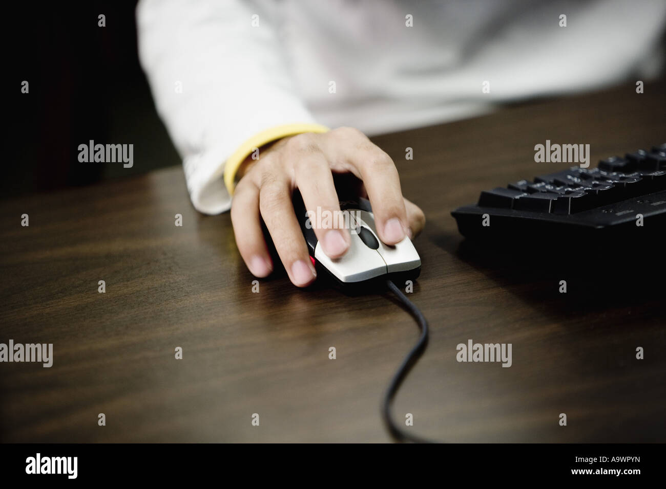 Close-up of a human hand using computer mouse Stock Photo - Alamy