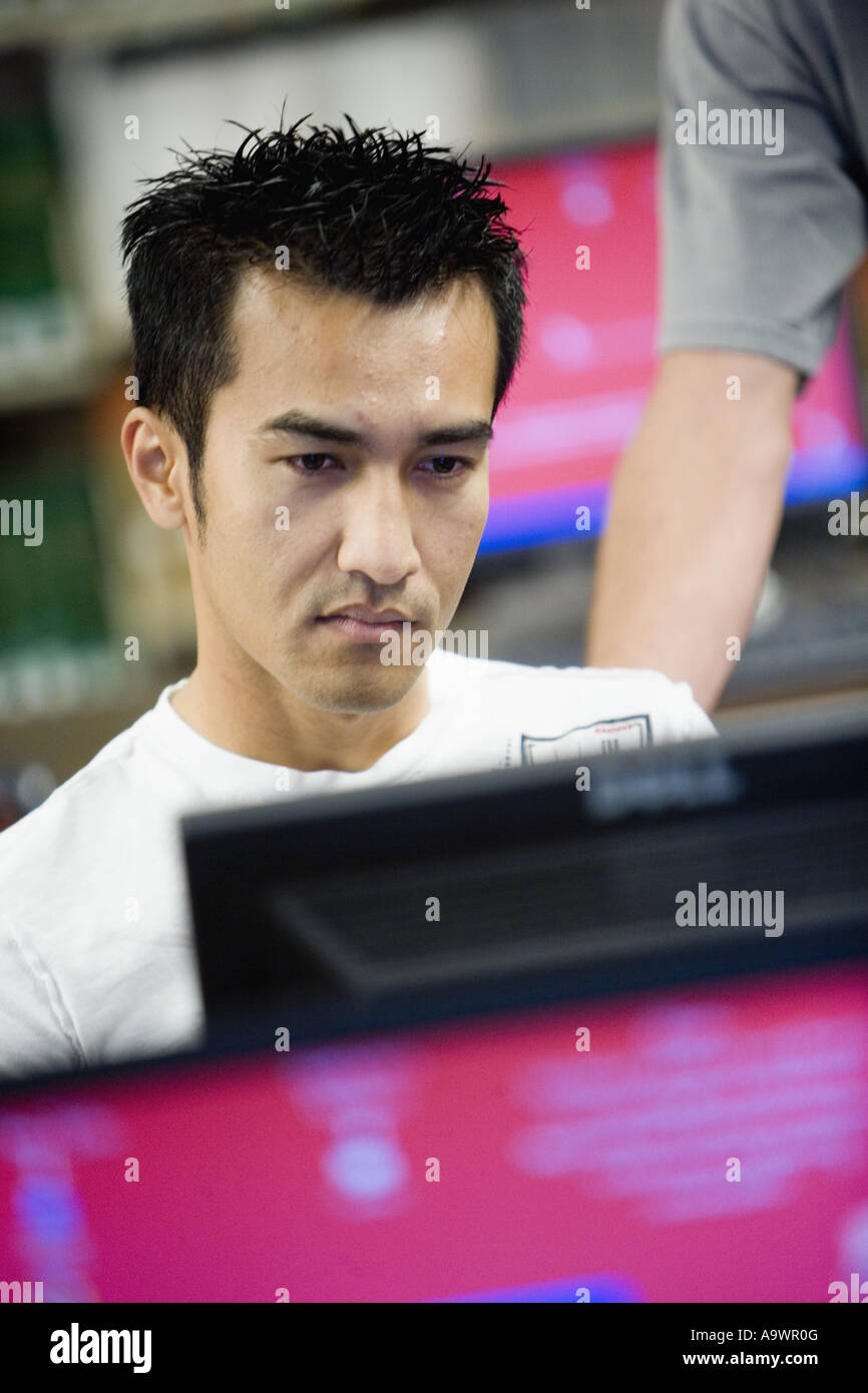 Student sitting in front of computer monitor Stock Photo - Alamy