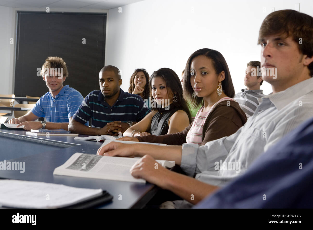 Portrait of students sitting in the classroom Stock Photo - Alamy