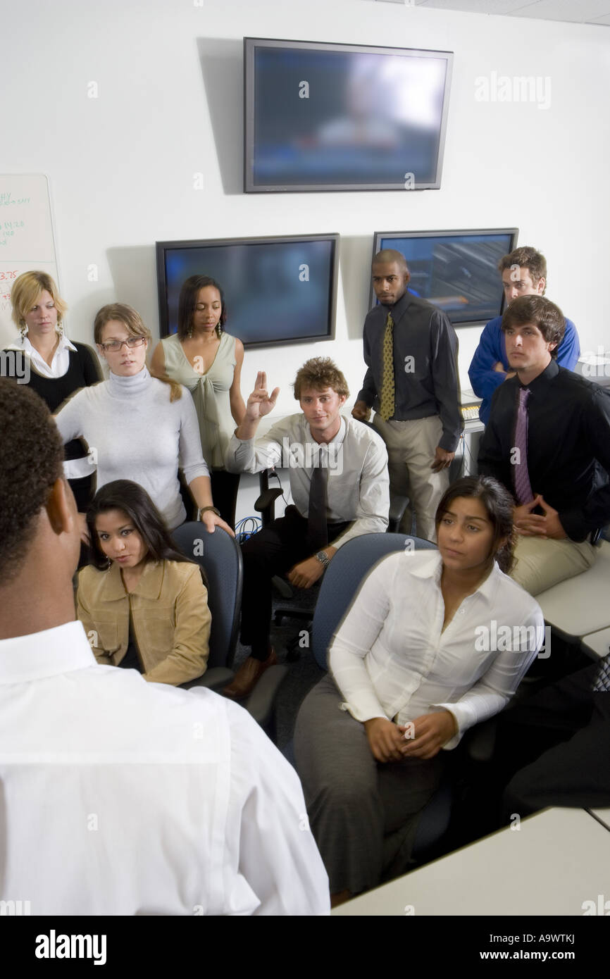 Group of young workers in office gathered for a meeting Stock Photo - Alamy
