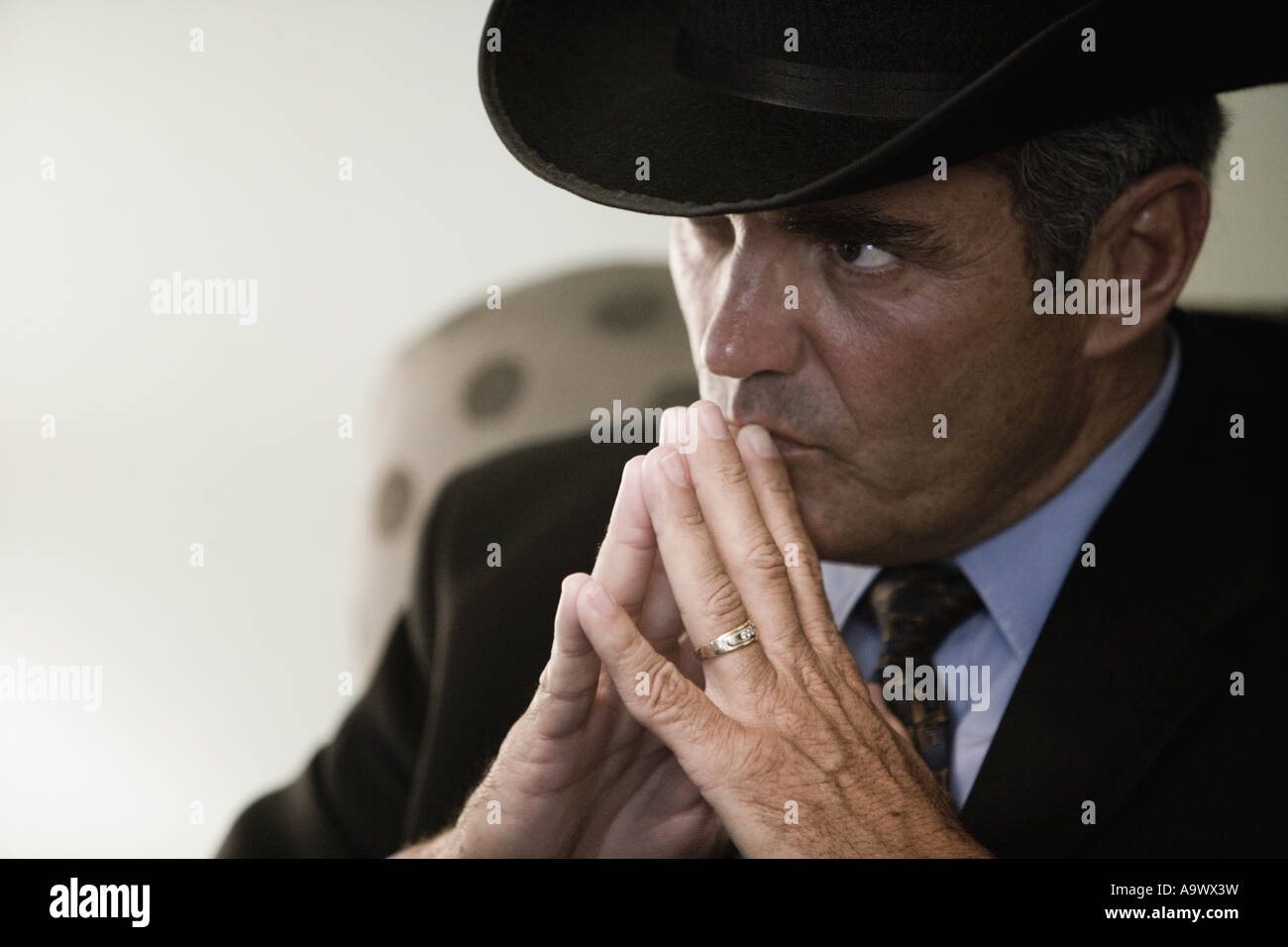 Businessman in contemplative mood Stock Photo - Alamy