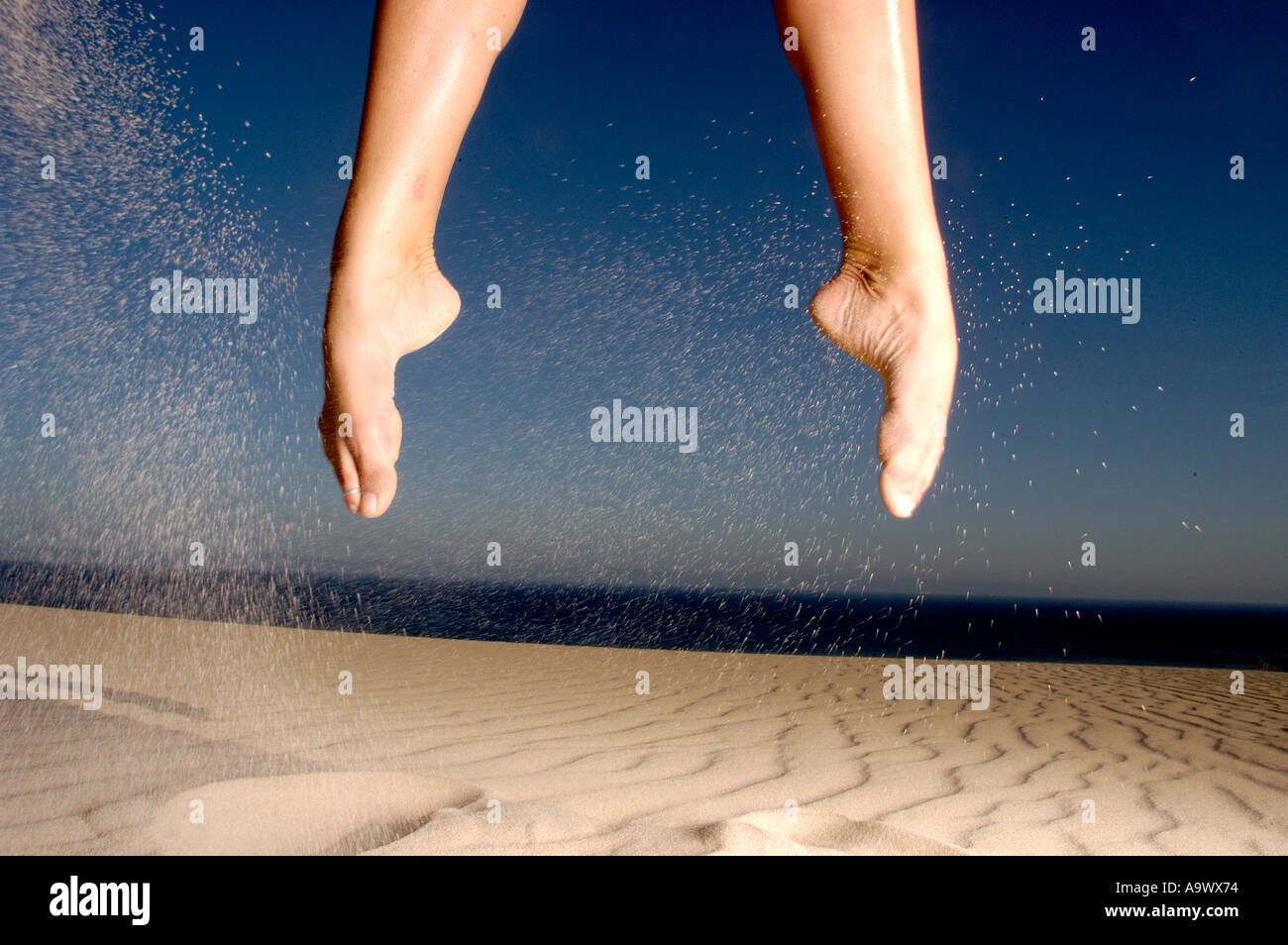 Feet in mid-air Stock Photo - Alamy