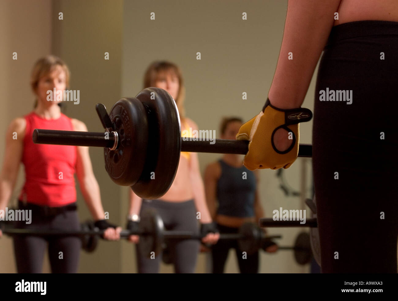 group of people in a gym doing weight lifting Stock Photo - Alamy