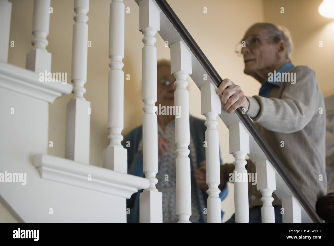 Couple climbing up stairs hi-res stock photography and images - Alamy