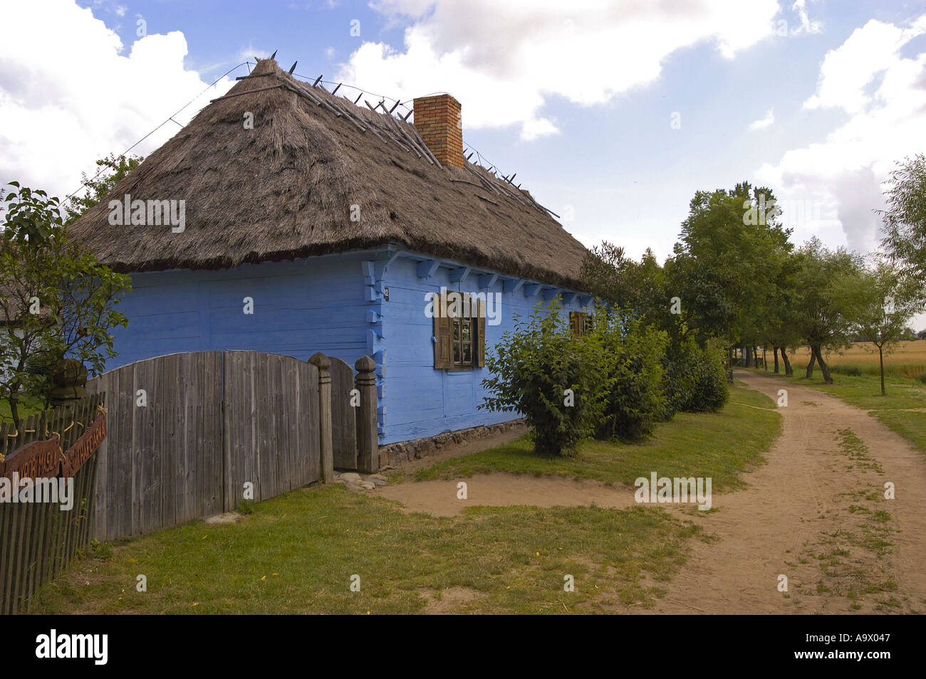 Old Polish blue wooden house with thatched roof from Mazowsze Open Air ...