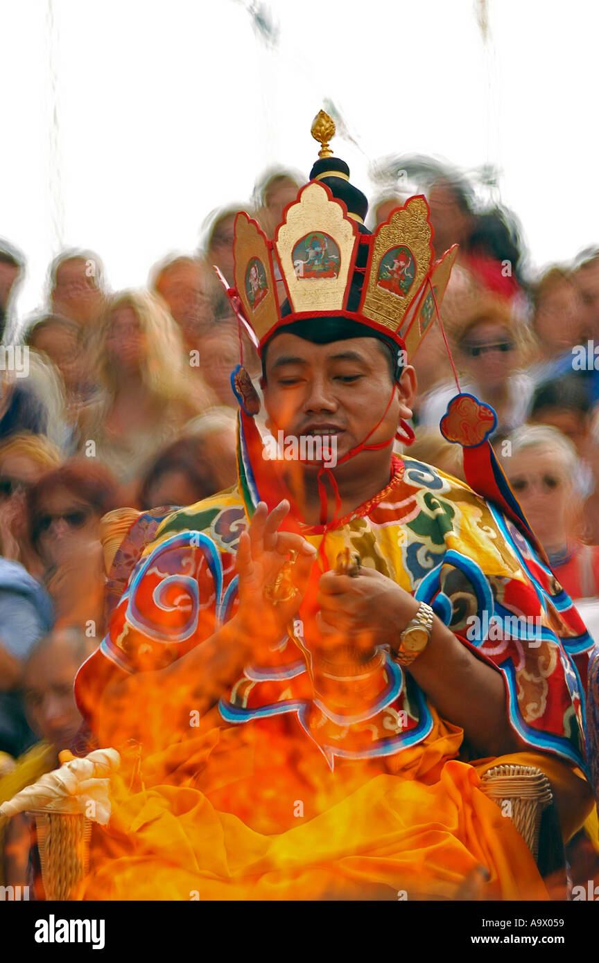 Monk performing Fire puja special buddhist ceremony for removing ...