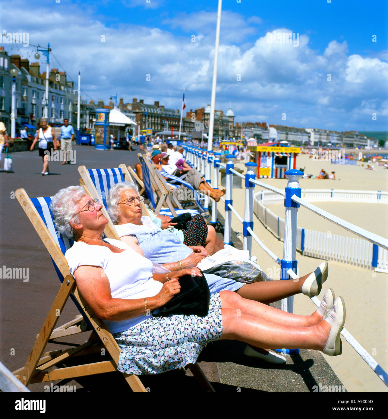 Elderly women pensioners sitting sleeping in deckchairs at the British ...