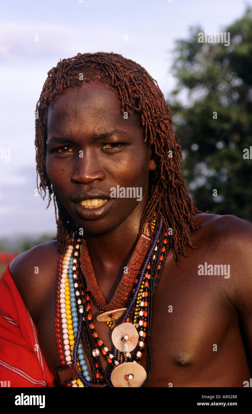 Lolgorian, Kenya. Siria Maasai Manyatta; a moran, red ochre coloured ...