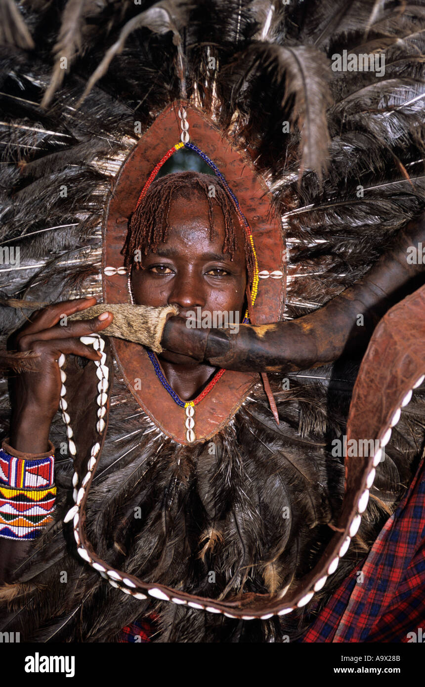 Lolgorian, Kenya. Siria Maasai Manyatta; moran 'lion head' with horn ...
