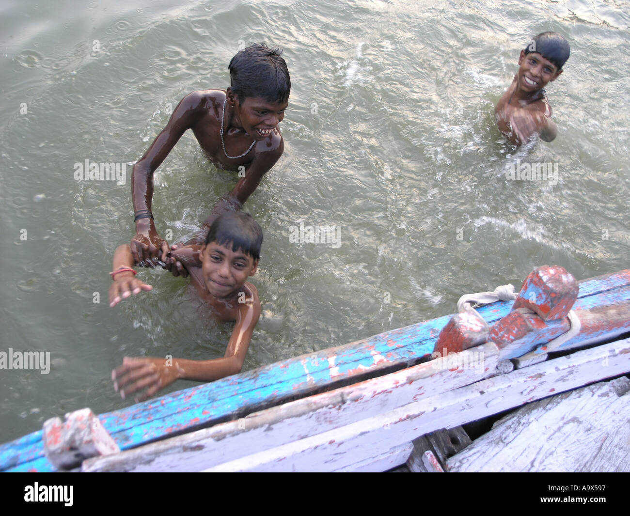 Splashing in ganges hi-res stock photography and images - Alamy