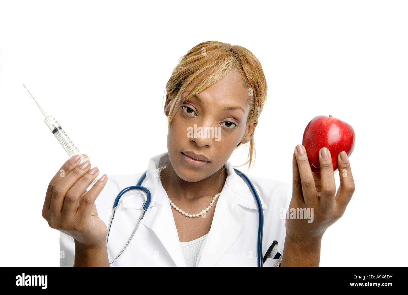 Young female doctor offering a patient a decision between healthy ...
