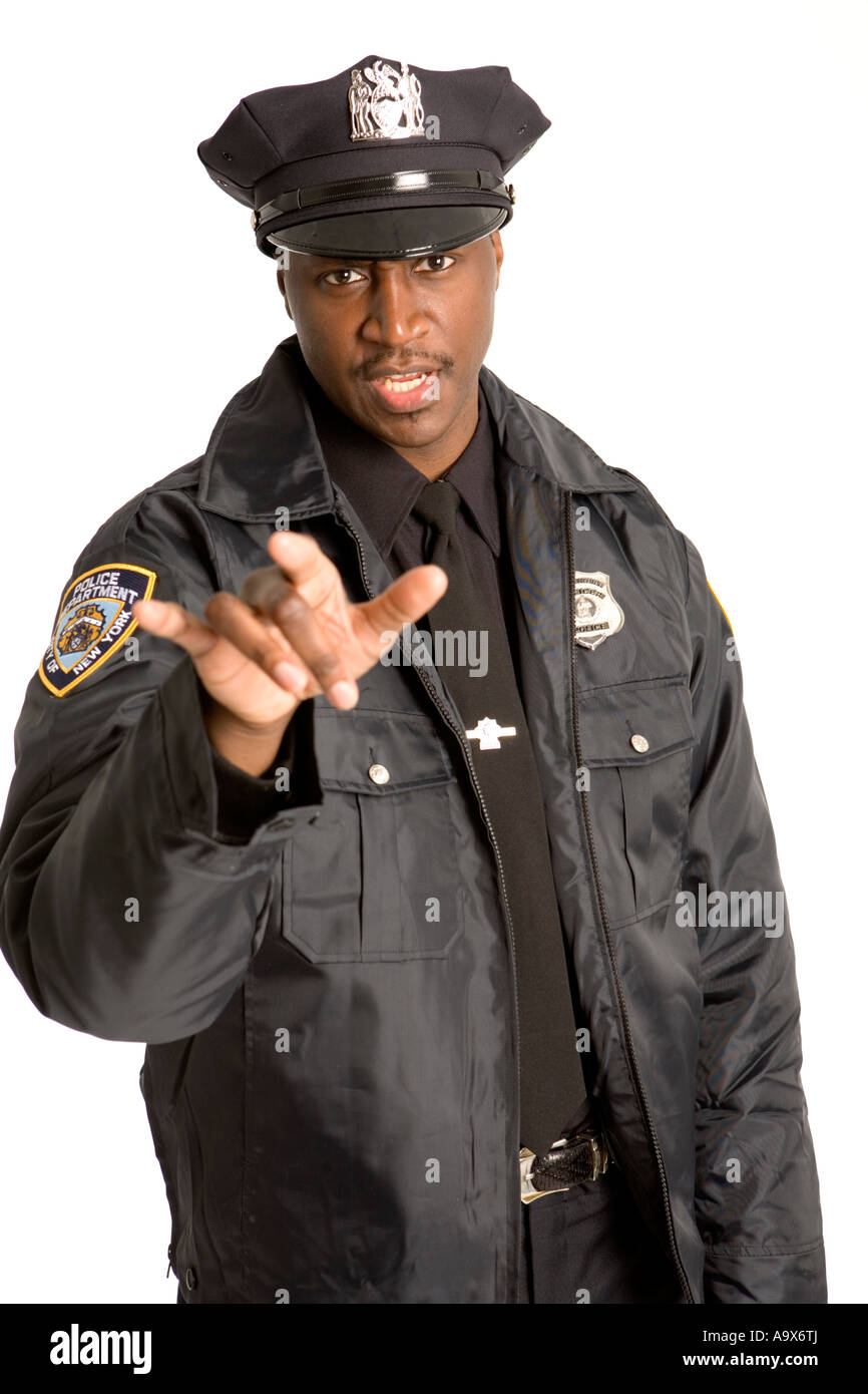 Young black American policeman points and speaks towards the viewer ... Young black American policeman points and speaks towards the viewer ...