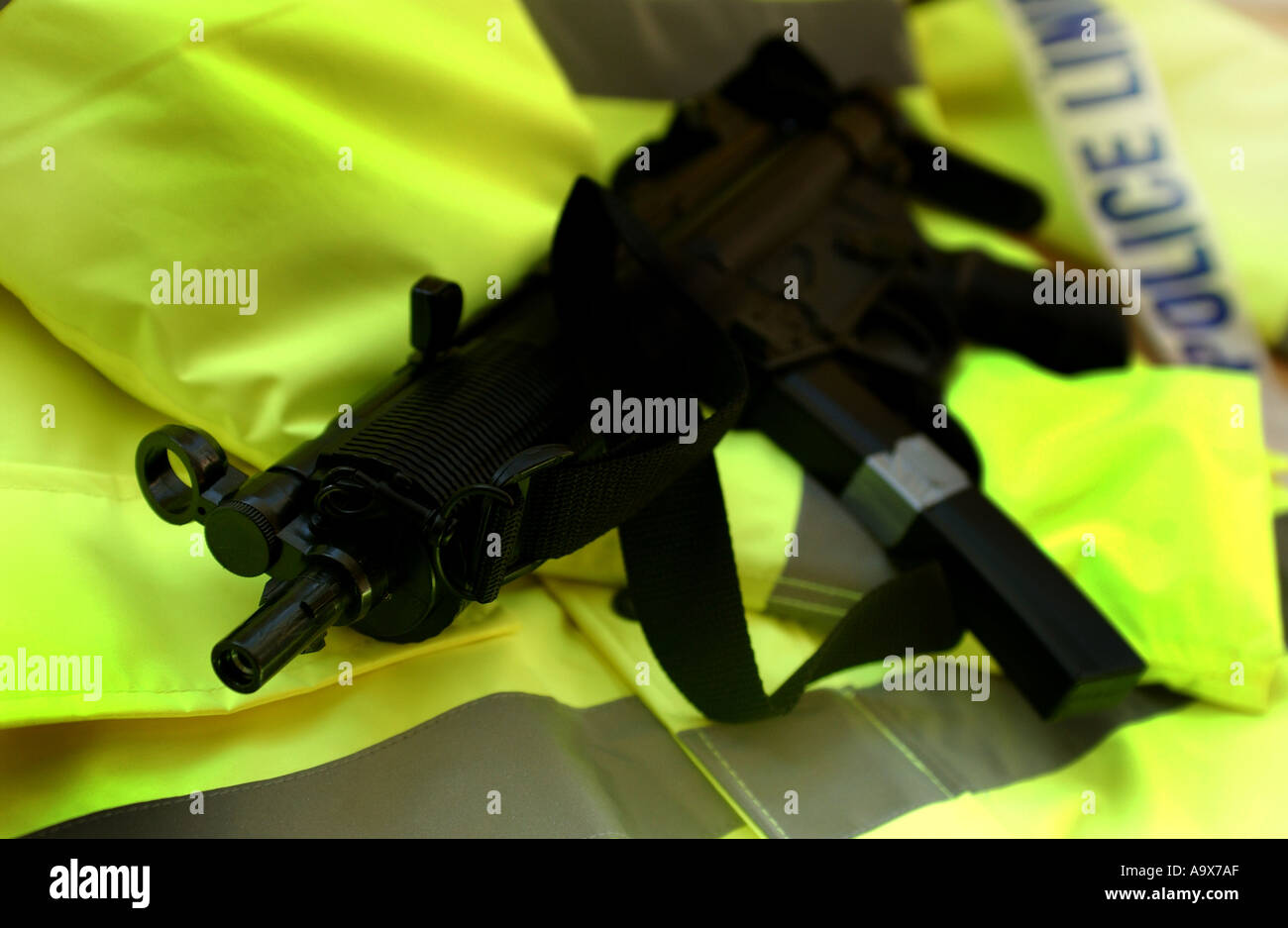 a Heckler and Koch MP5 machinegun surrounded by police tape and jacket ...