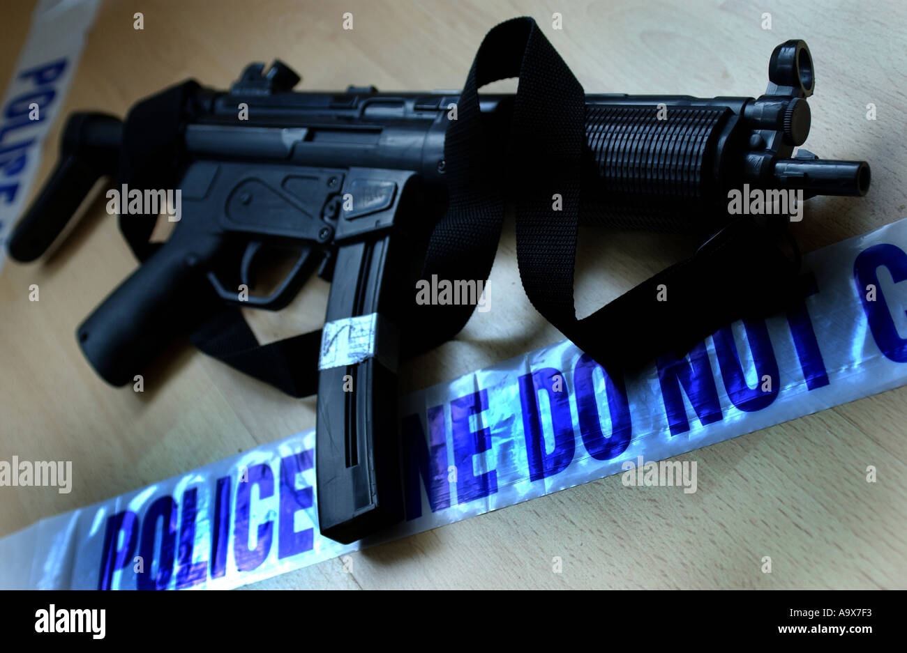 a heckler and koch MP5 machinegun surrounded by police tape Stock Photo ...