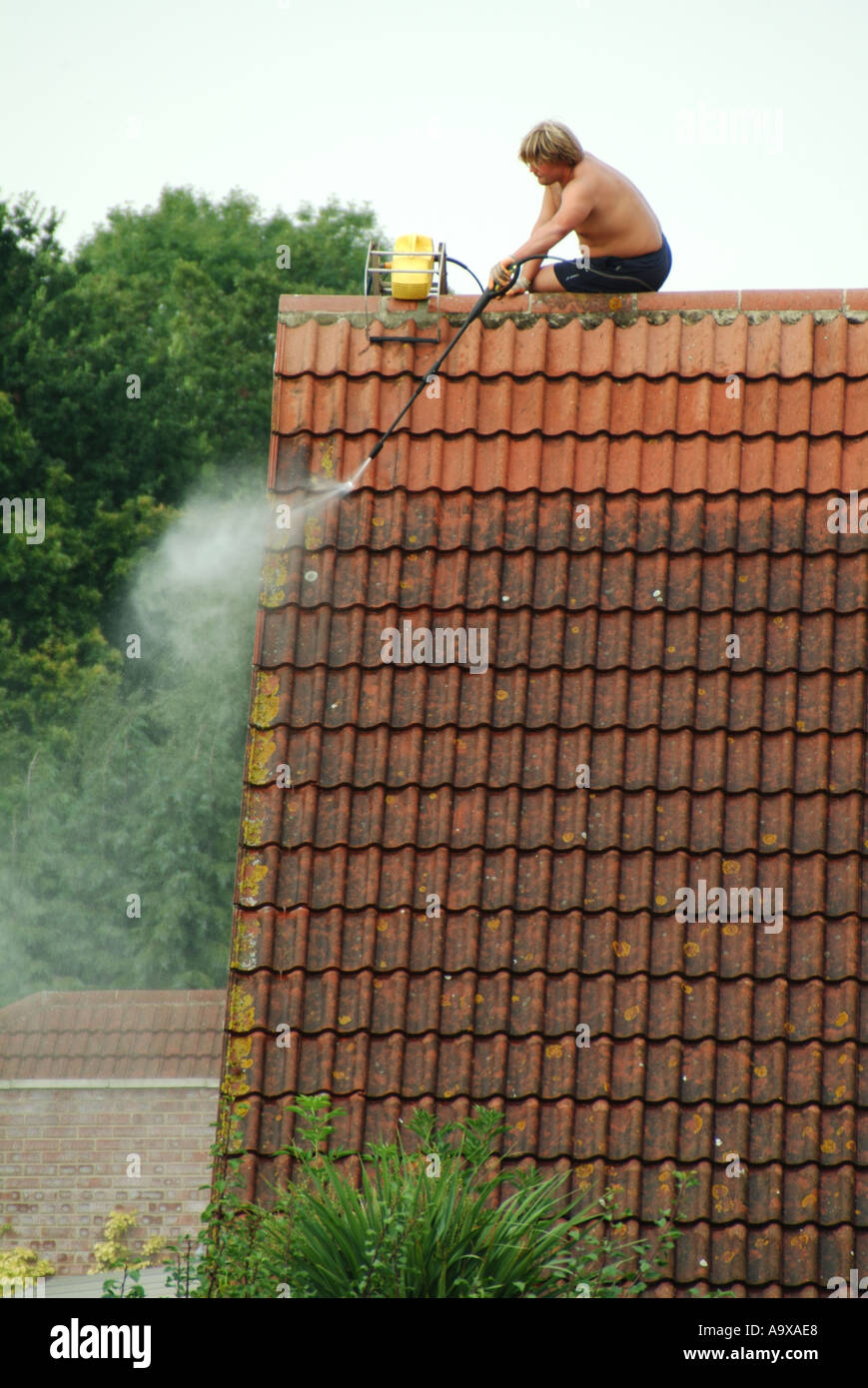 Pressure cleaning roof spray hi-res stock photography and images - Alamy